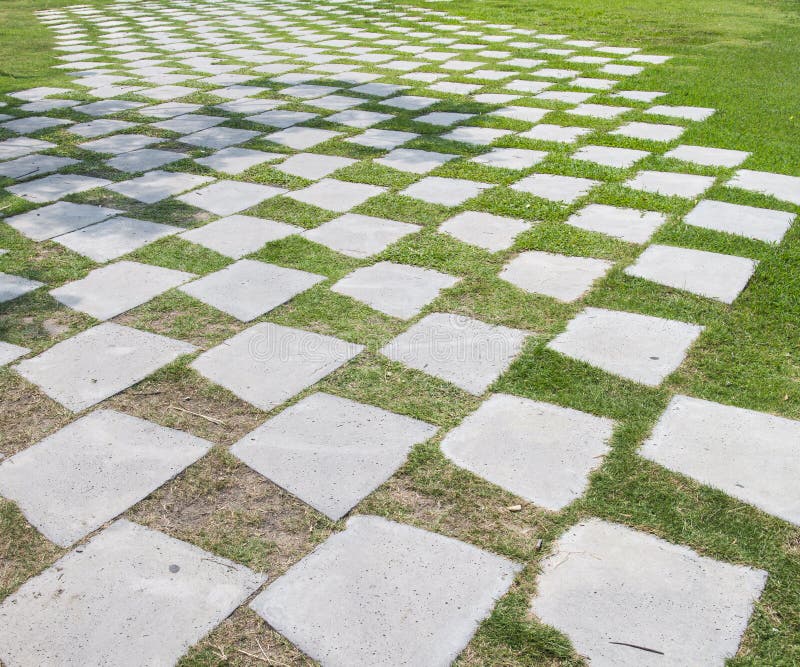 Stone Walkway Pattern on a Grass Field in Perspective View Stock Photo ...