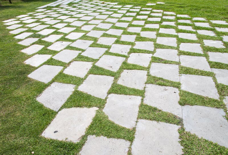 Stone Walkway Pattern on a Grass Field in Perspective View Stock Photo ...