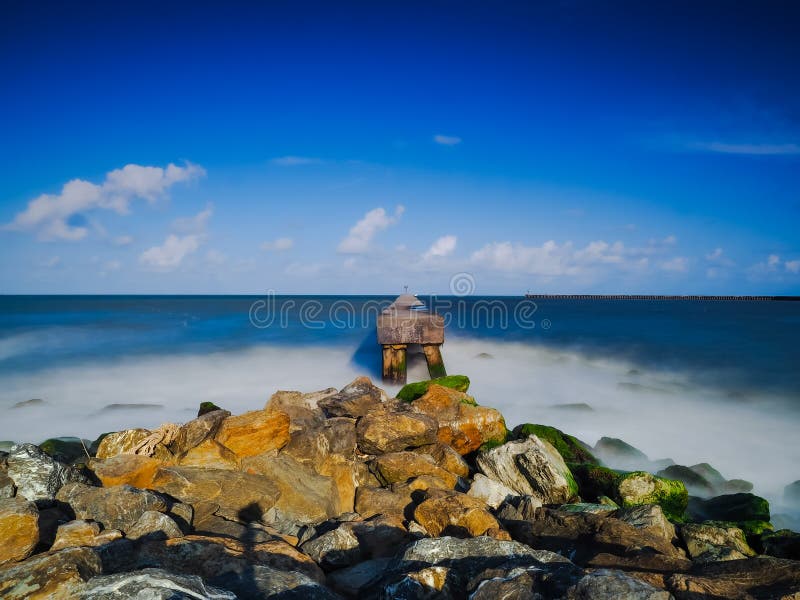 Stone Wall Against Waves , Sea,sky and Clouds Stock Image - Image of ...