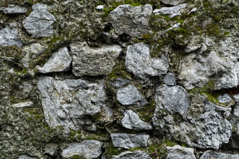 Stone Wall As a Background or Texture. Moldy Masonry. an Example of ...