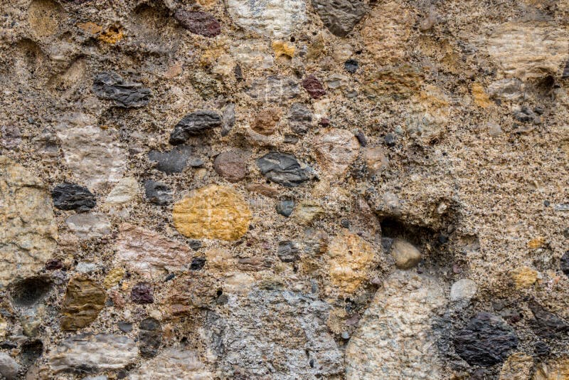 Stone Wall Background Wall Made of Cavern Rock Stock Photo - Image of ...