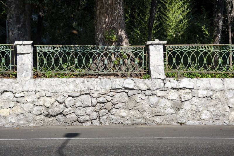 Stone Wall Background Texture. Building Facade, High Fence Made of ...