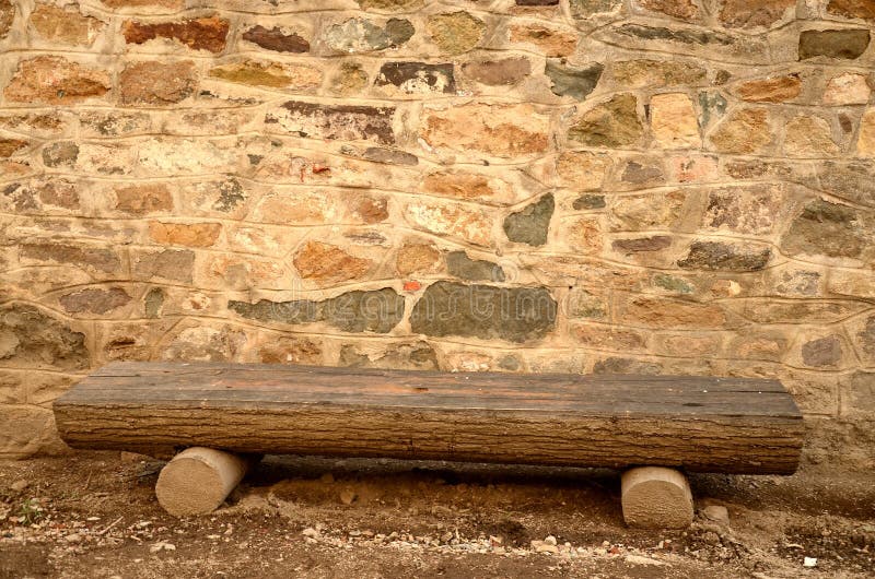 Stone wall and bench stock photo. Image of cute, building - 23998896