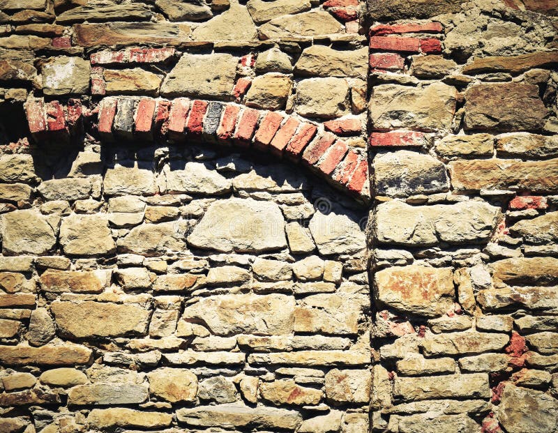 Stone wall with brick arch stock photo. Image of exterior - 71444066