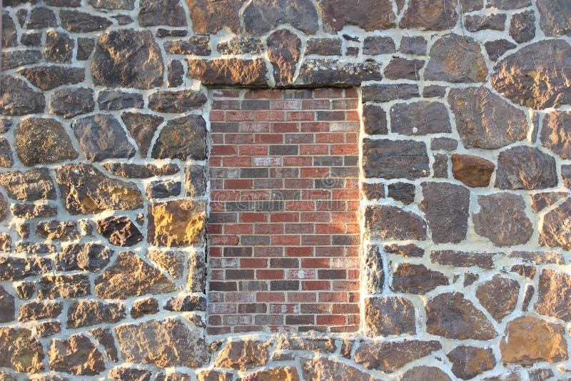 Stone Wall with Brick Filled Window Stock Photo - Image of brick, worn ...