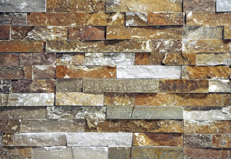 Stone Wall Cladding Made of Strips of Natural Rocks Stacked. Stock ...