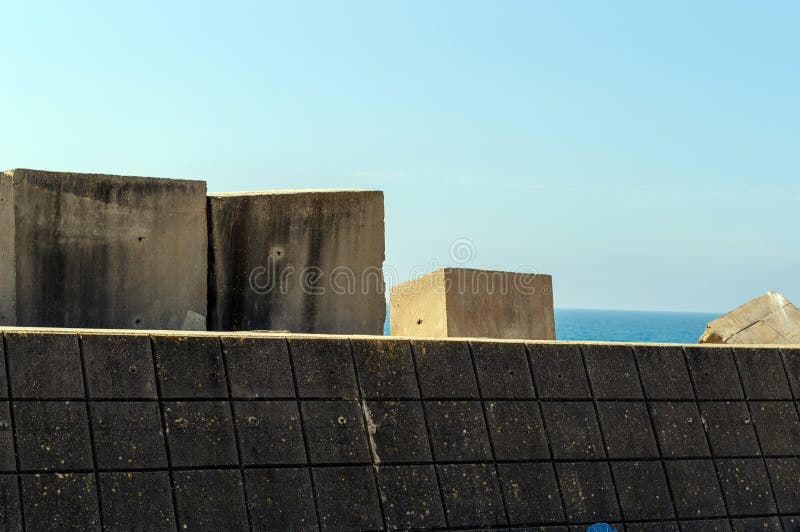 Stone Wall with Stone Cubes on Top Stock Image - Image of industries ...