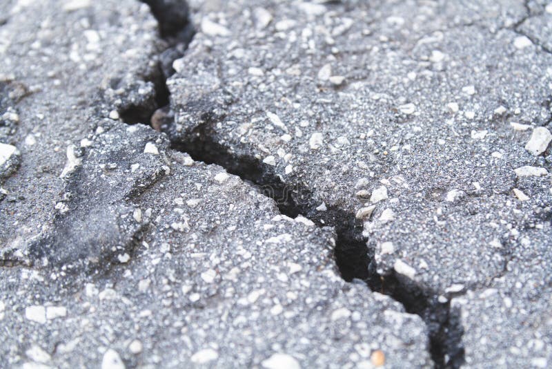 Stone Wall with Deep Cracks. Break in the Ground. Drought and ...