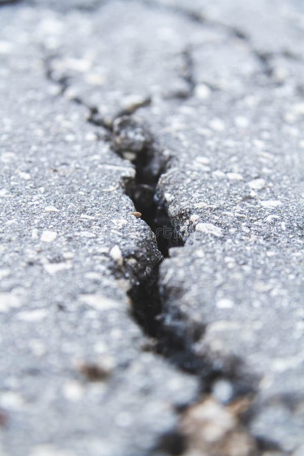 Stone Wall with Deep Cracks. Break in the Ground. Drought and ...