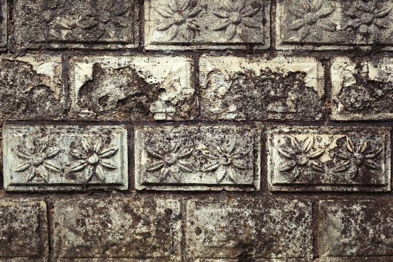 Stone Wall with Flower Relief on Each Stone Brick Stock Image - Image ...