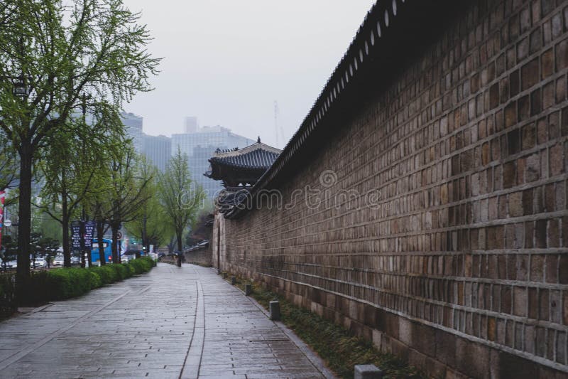 Stone Wall and Footpath Alongside a Street Stock Image - Image of brick ...