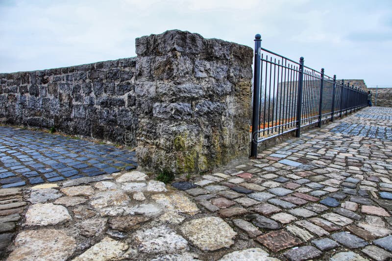 A Stone Wall with a Gate in the Middle Stock Photo - Image of wall ...
