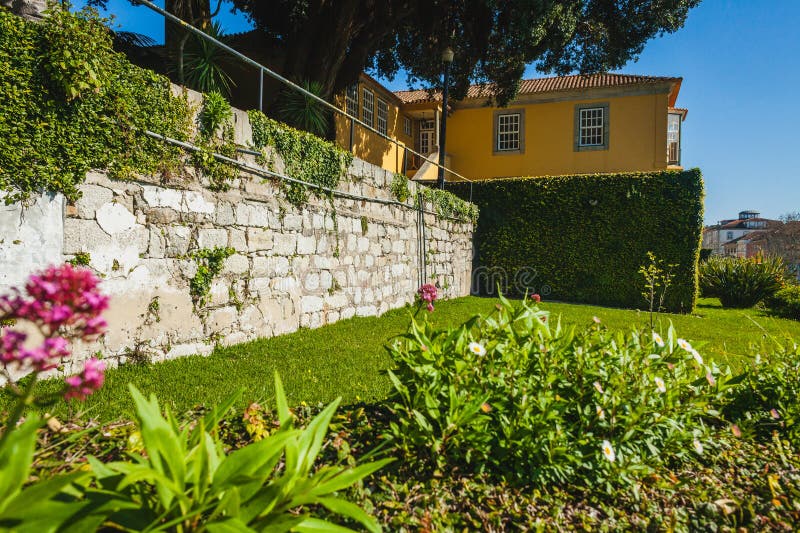 Stone Wall with Grass N the Garden Stock Image - Image of historic ...