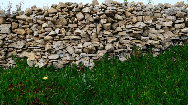 Stone Wall and Green Grass - Wallpaper, Background Stock Photo - Image ...