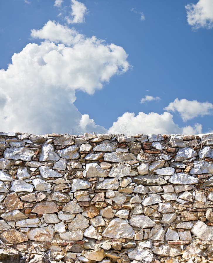 Stone Wall with Large Stone Blocks Against a Sky Background - Image ...