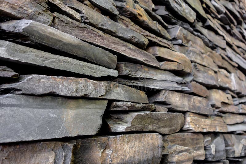 The Stone Wall Made of Slate Bricks Which is Very Rough Material Stock ...