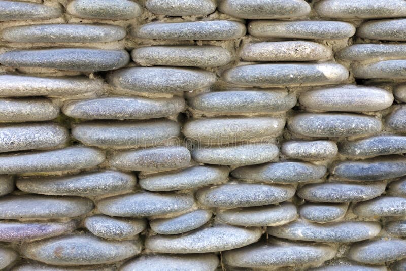 Stone Wall of Natural Stones of Different Sizes. Stock Photo - Image of ...