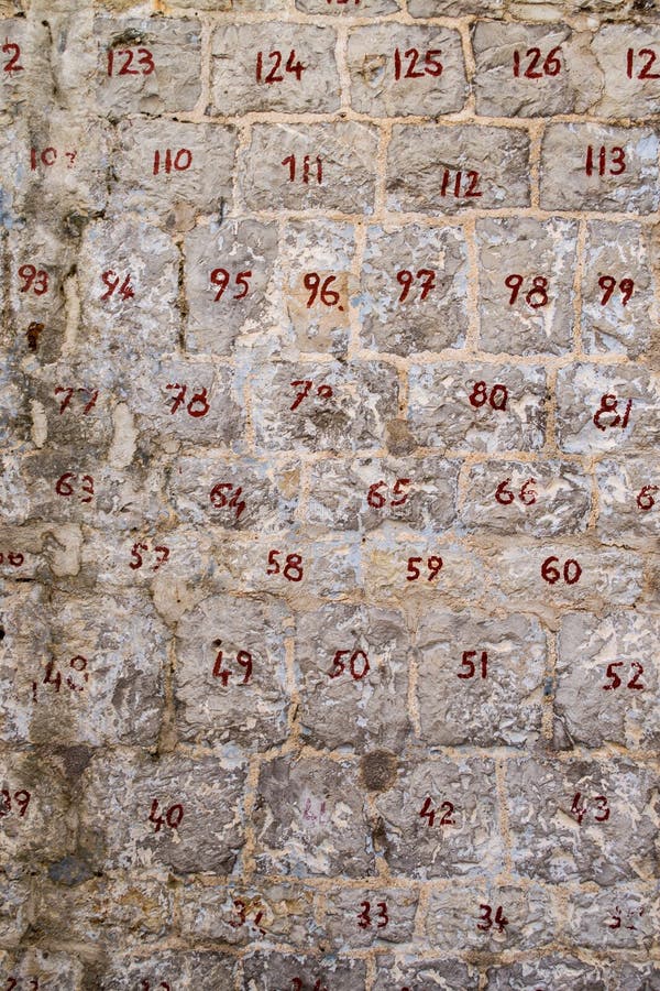 Stone Wall with Numbered Stones. Two-digit Red Numbers on the Stones ...