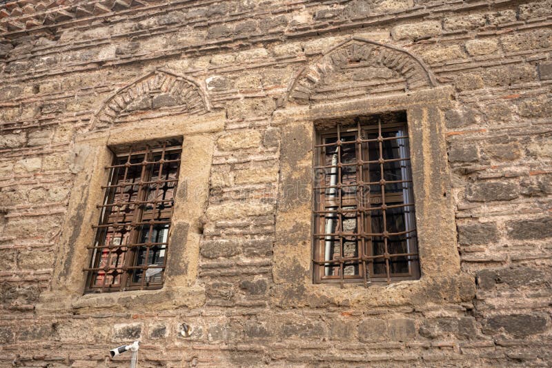 Stone Wall of an Old Building, with a Grate on the Window Stock Image ...