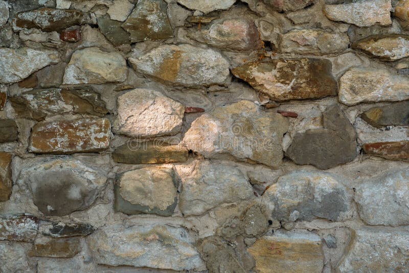 Stone Wall, Old Crumbling Stone Wall Made of Stone and Sandstone ...