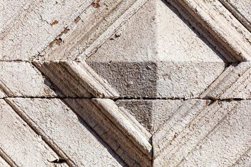 A Stone Wall with a Pattern of Squares and Triangles Stock Photo ...