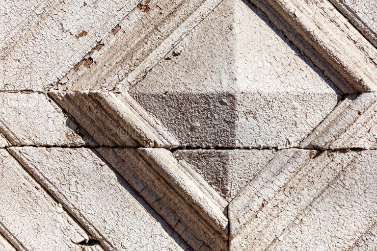 A Stone Wall with a Pattern of Squares and Triangles Stock Photo ...