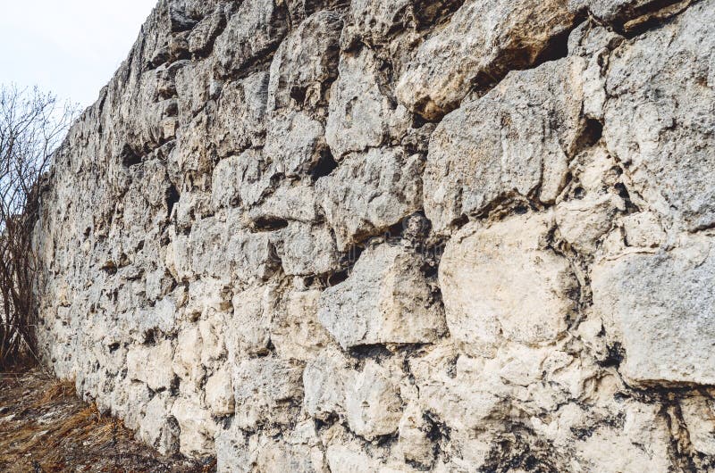 Stone Wall. Paved Wall with a Rough, Clear Texture and Deep Lines ...
