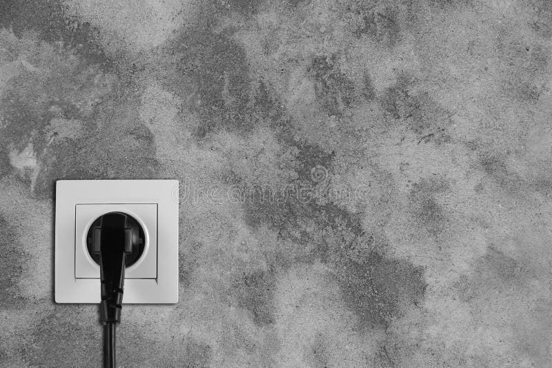 Wall with Power Socket and Inserted Plug, Space for Text. Electrical ...