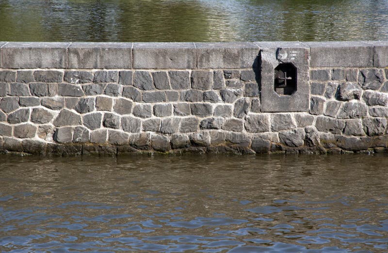 Stone wall in the river stock image. Image of river, boat - 59681929