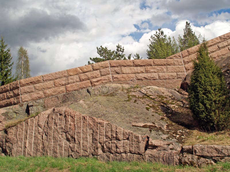 A stone wall on a rock stock photo. Image of architecture - 1015570