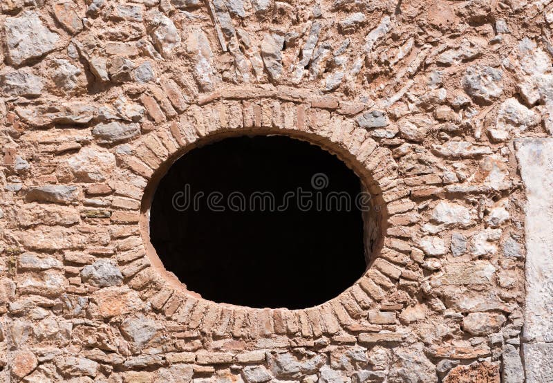 Stone Wall with Round Window of an Ancient Fortress. Stock Image ...