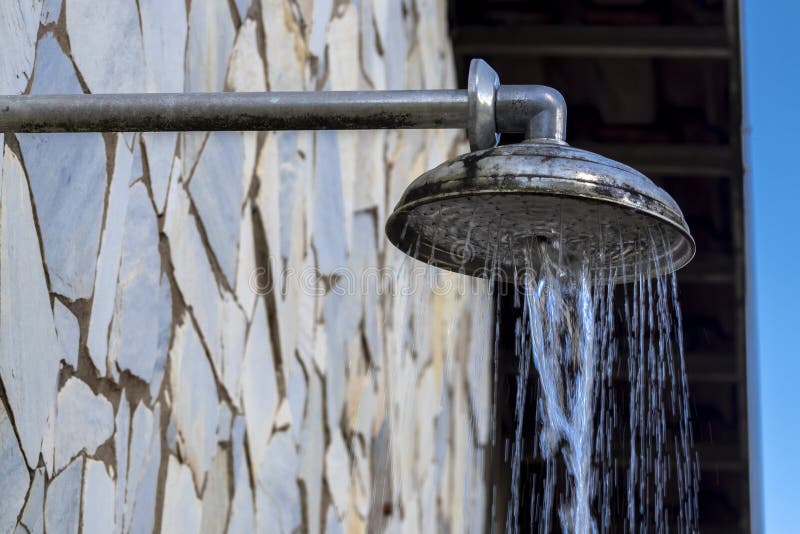 Stone Wall with Shower with Falling Water, Outdoors in a Swimming Pool ...