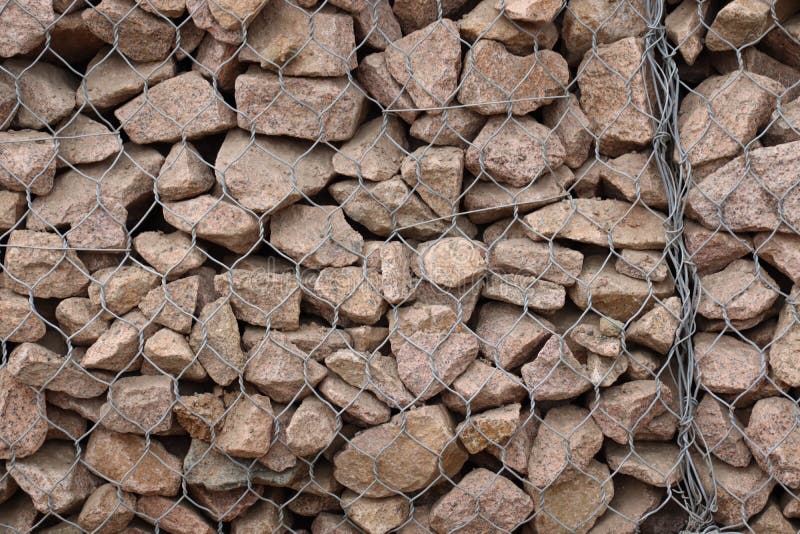 Stone wall stock photo. Image of gravel, mesh, boulder - 213425754
