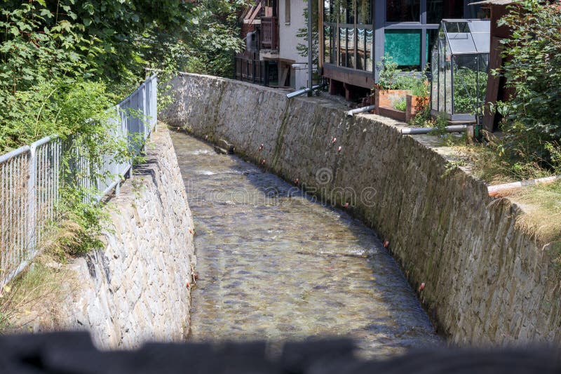 A Stone Wall Touches the Edge of the Channel Stock Photo - Image of ...
