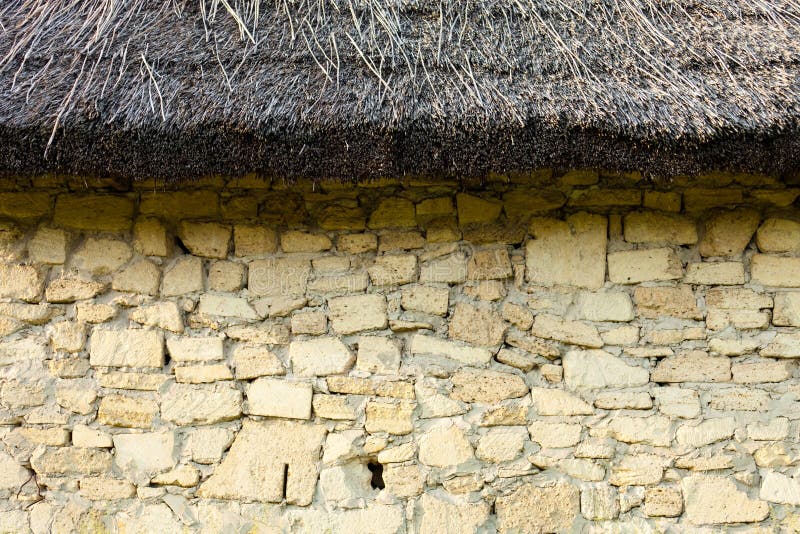 Stone Wall Under the Thatched Roof Stock Photo - Image of masonry ...