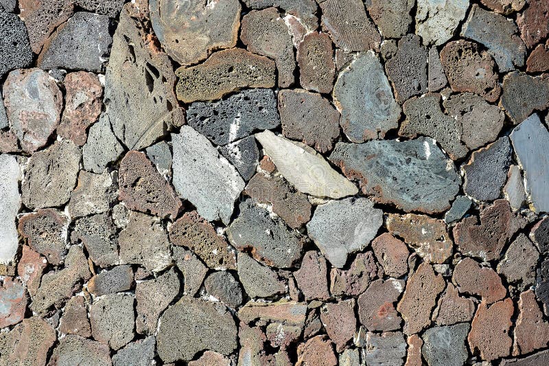 A Stone Wall with a Variety of Different Sized Rocks Stock Image ...