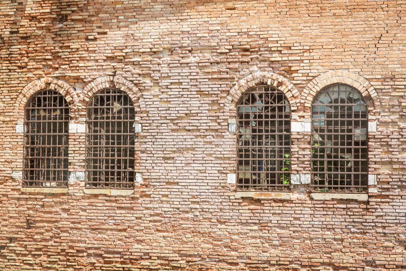 Stone wall with windows stock photo. Image of orange - 74296484