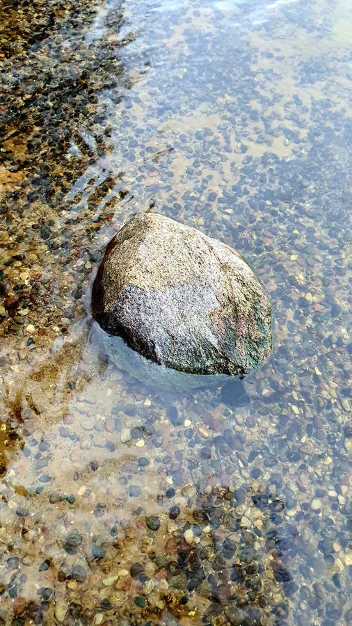 Stone in the water stock image. Image of stone, water - 168109823
