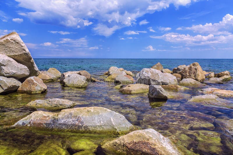 Stone in water stock photo. Image of clouds, backgrounds - 67278896