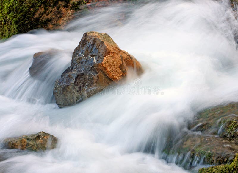 Stone in waterfall stream stock photo. Image of waterfall - 12615442