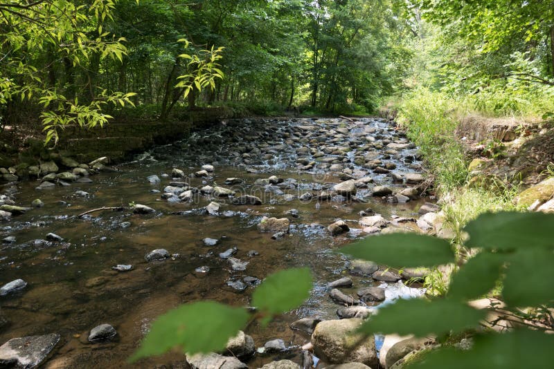 Stone weir on a stream stock photo. Image of rural, step - 174572766