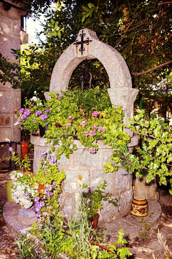 Stone Well for Water Decorated with Flowers Stock Photo - Image of ...
