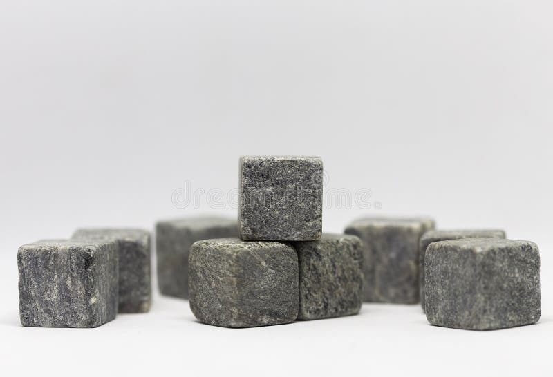 Stone Whiskey Cubes. a Collection of Grey, Textured Stone Cubes ...