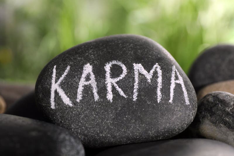 Stone with Word Karma on Blurred Background, Closeup Stock Image ...
