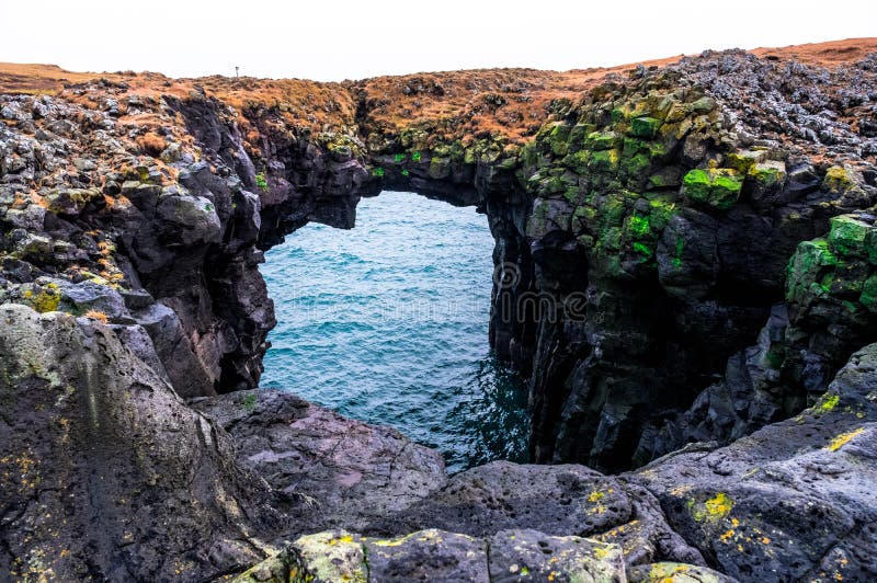Stonebridge a Volcanic Stone Arch at Arnarstapi, West Iceland Stock ...