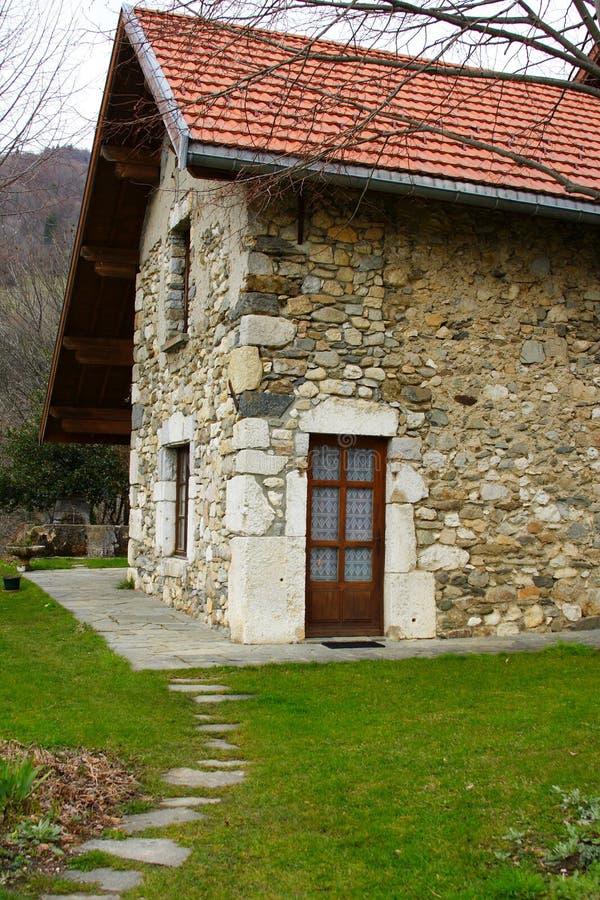 Stoned house and garden stock image. Image of alps, construction - 2227711