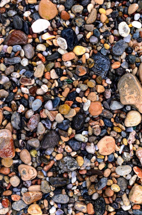 Small stones on the beach stock photo. Image of stone - 126917316