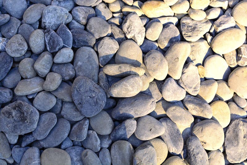 Stones on the Beach, Half Bright, Half Dark Stock Photo - Image of rock ...