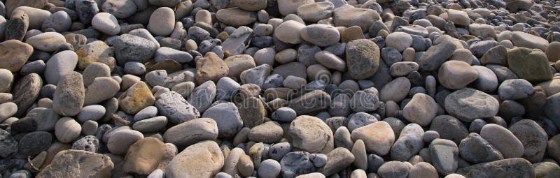 Stones on a beach stock image. Image of colorful, cobblestone - 69924357