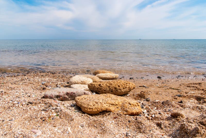 Stones on the beach stock photo. Image of blue, shape - 72727612